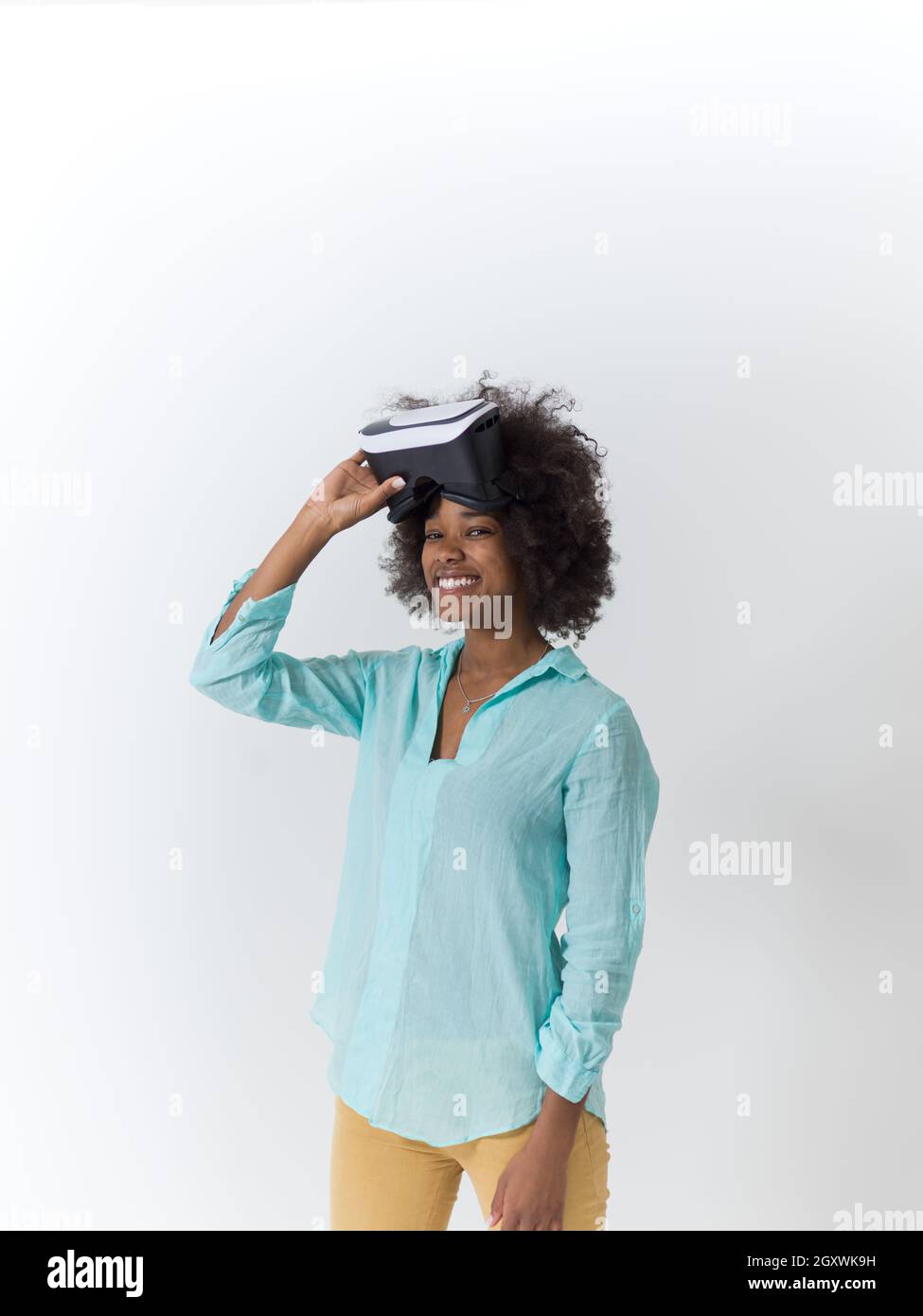 Happy african american girl getting experience using VR headset glasses ...