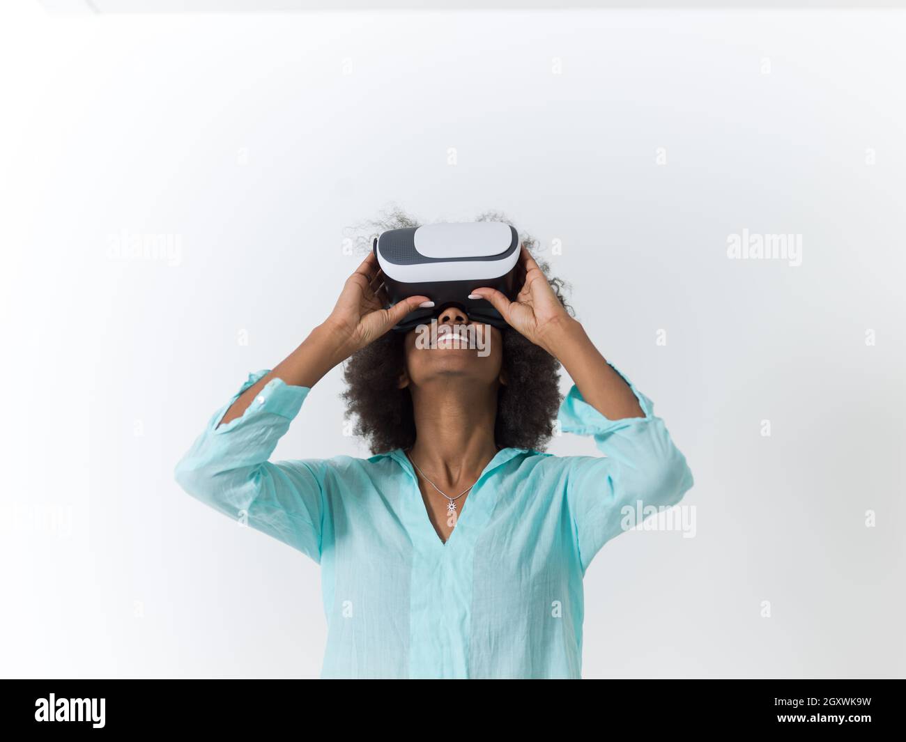 Happy african american girl getting experience using VR headset glasses ...