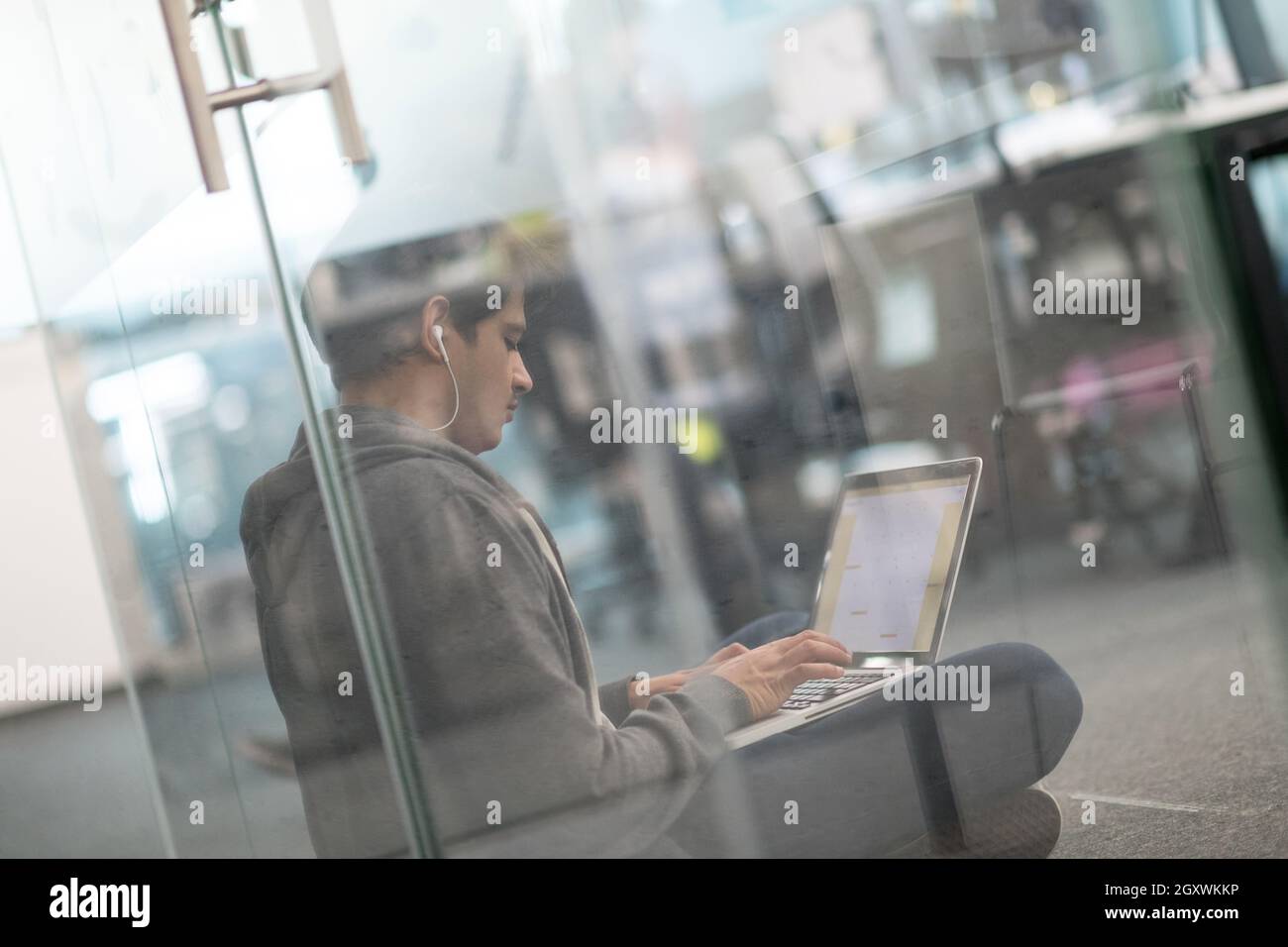 young indian software developer man using laptop computer writing ...