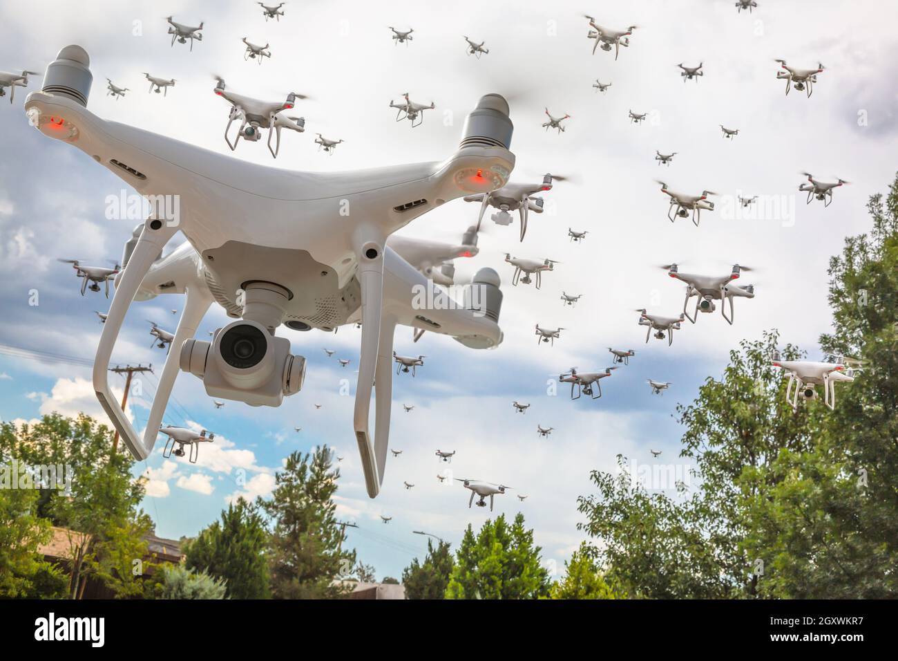 Dozens of Drones Swarm in the Cloudy Sky Stock Photo - Alamy