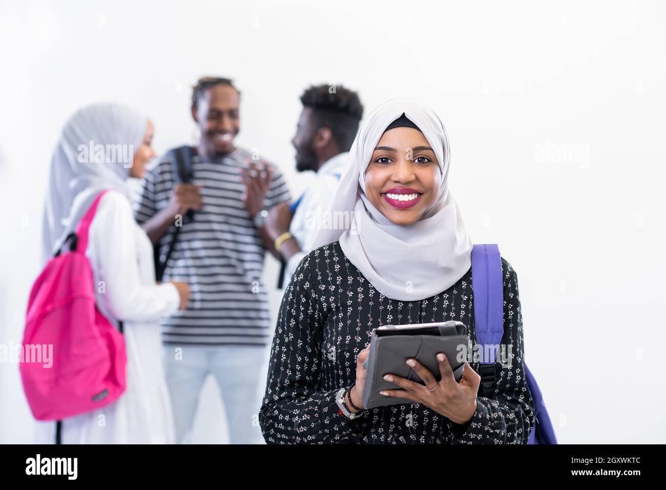 young african modern muslim female student using tablet computer with ...