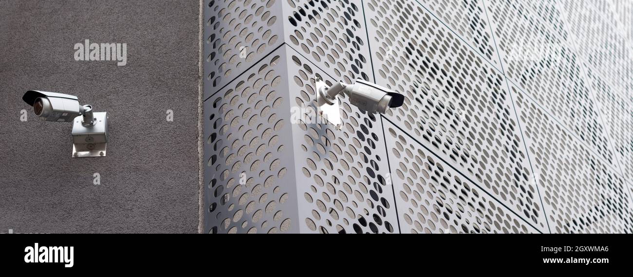 Security cameras on modern building. Professional surveillance camera ...