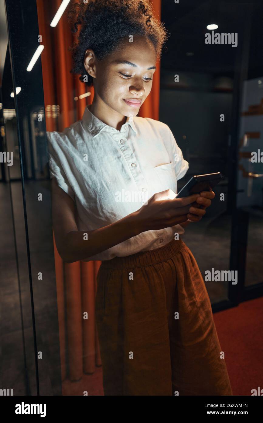 Female person searching information in smartphone for meeting Stock ...