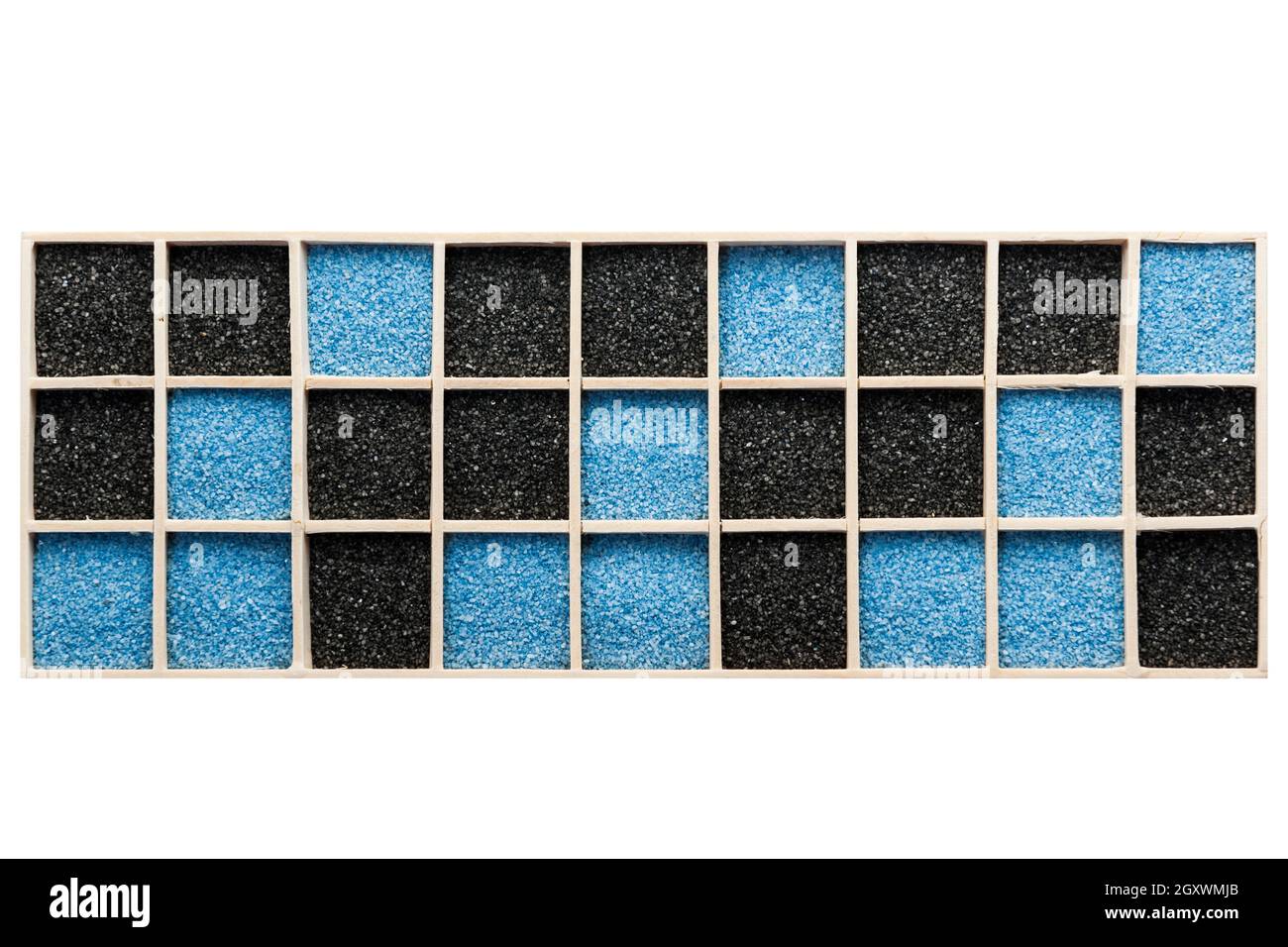 Blue and black decorative sand distributed in a rectangular wooden box ...
