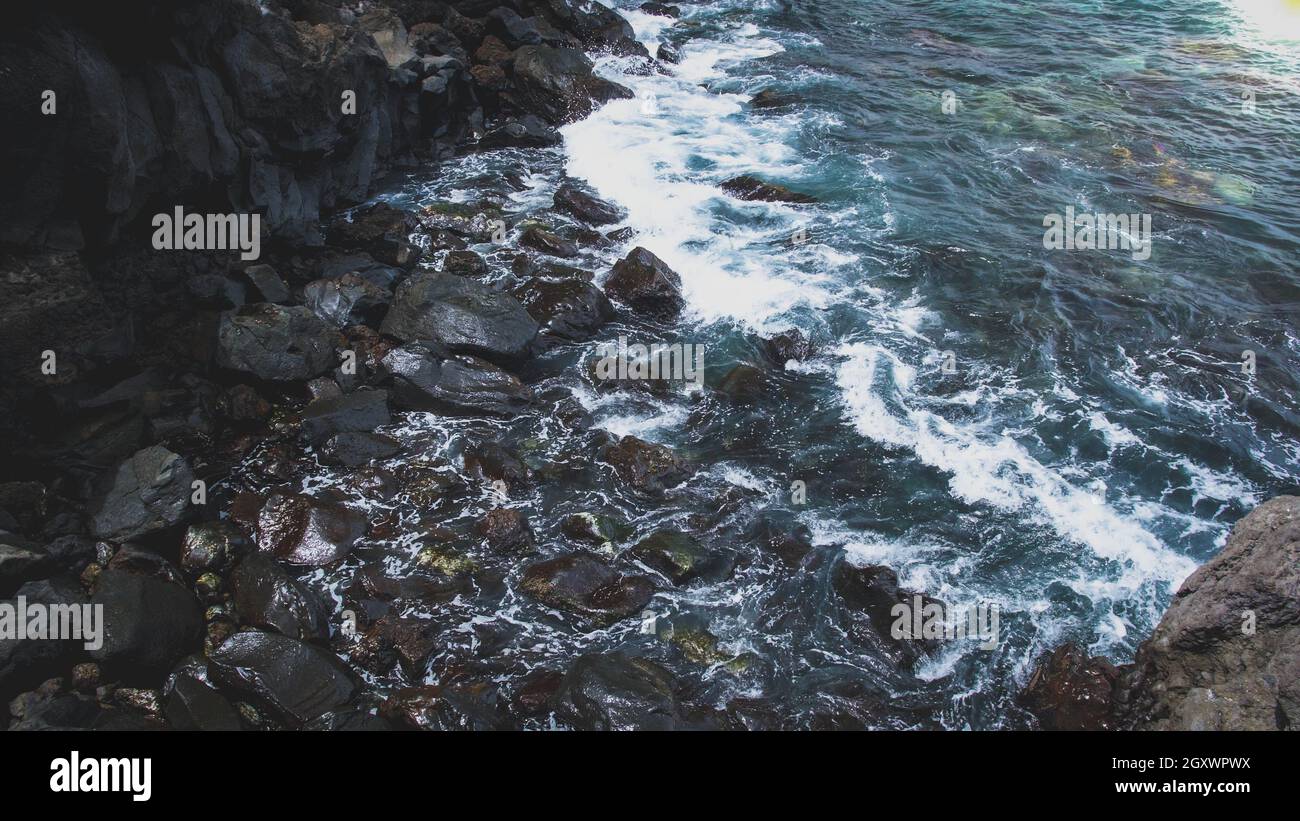 Aerial tropical beach between rocks hi-res stock photography and images ...