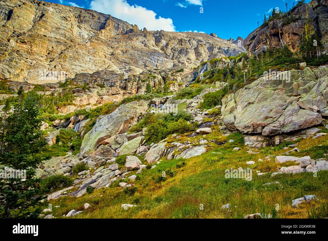 Landscape high up in mountains with boulders and waterfalls Stock Photo ...