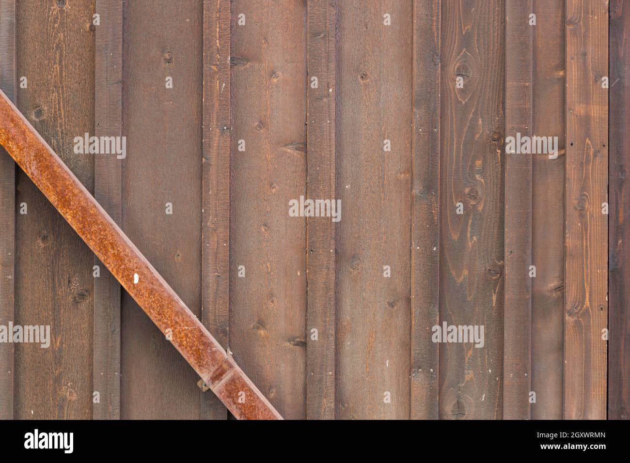 Wooden Wall with Rusty Metal Beam Background Stock Photo - Alamy