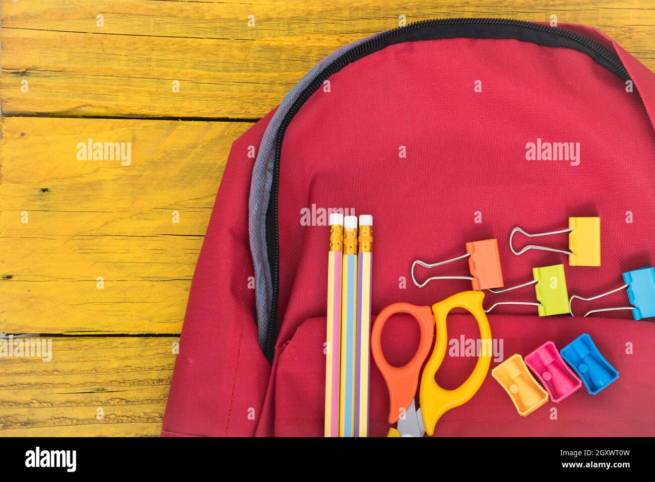 Top view flat lay of red school bag backpack and accessories tools for ...