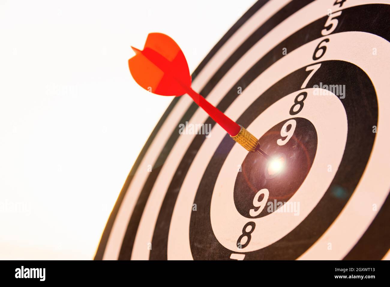 Dart arrow hitting to center on bullseye (bull's-eye) dartboard is the ... Dart arrow hitting to center on bullseye (bull's-eye) dartboard is the ...