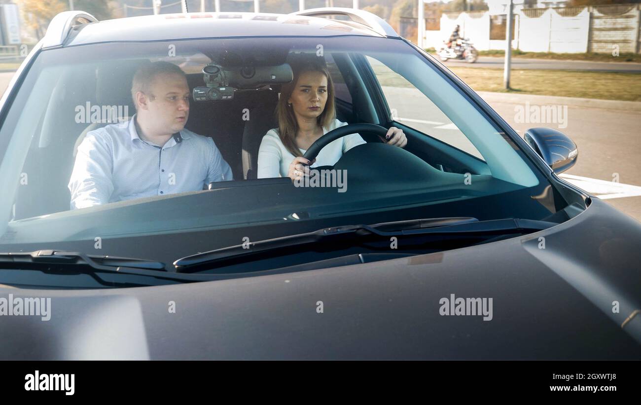 Portrait of upset angry woman with husband driving a car Stock Photo ...