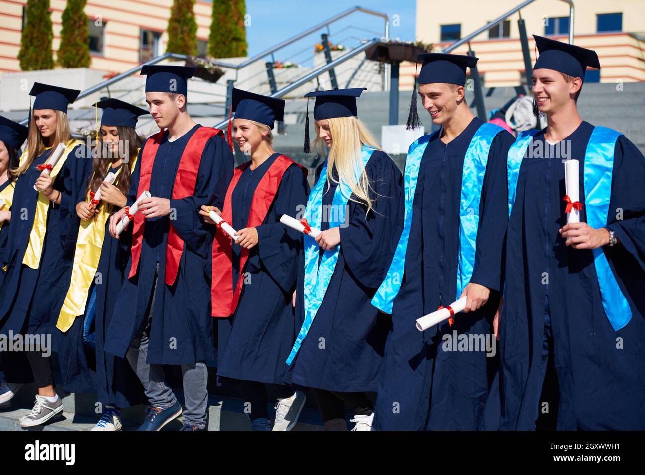 young graduates students group standing in front of university building ...