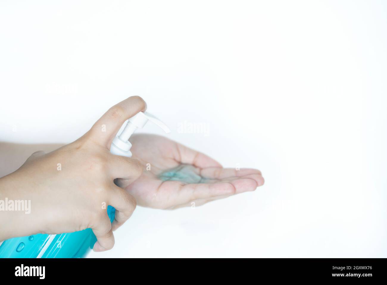Alcohol gel. Cleaning hands a finger pumping sanitizer onto hand ...
