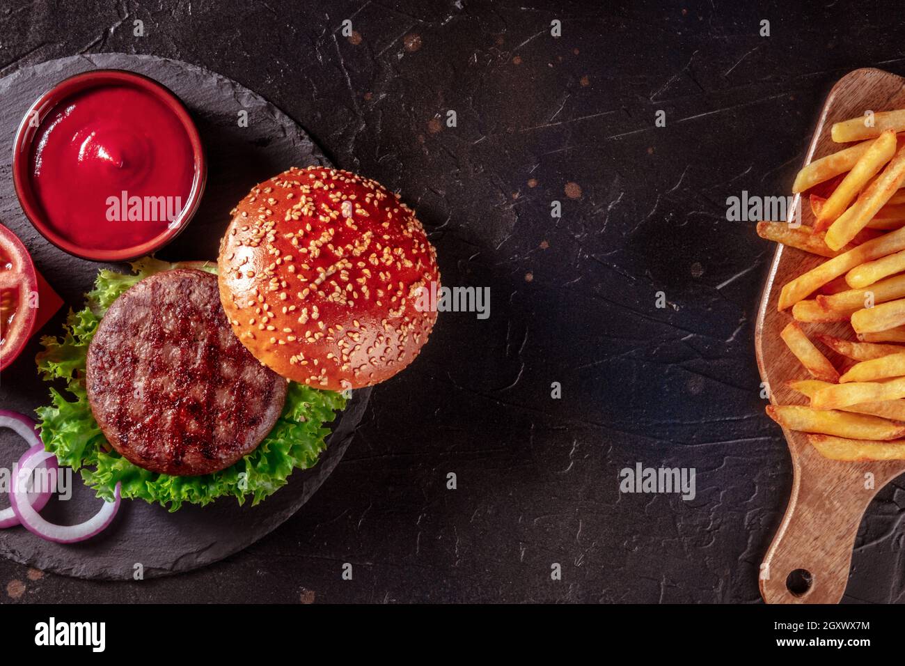 Burger and French fries, fast food background with copy space ...