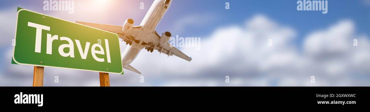 Travel Green Rodd Sign Banner with Airplane Flying Above Stock Photo ...