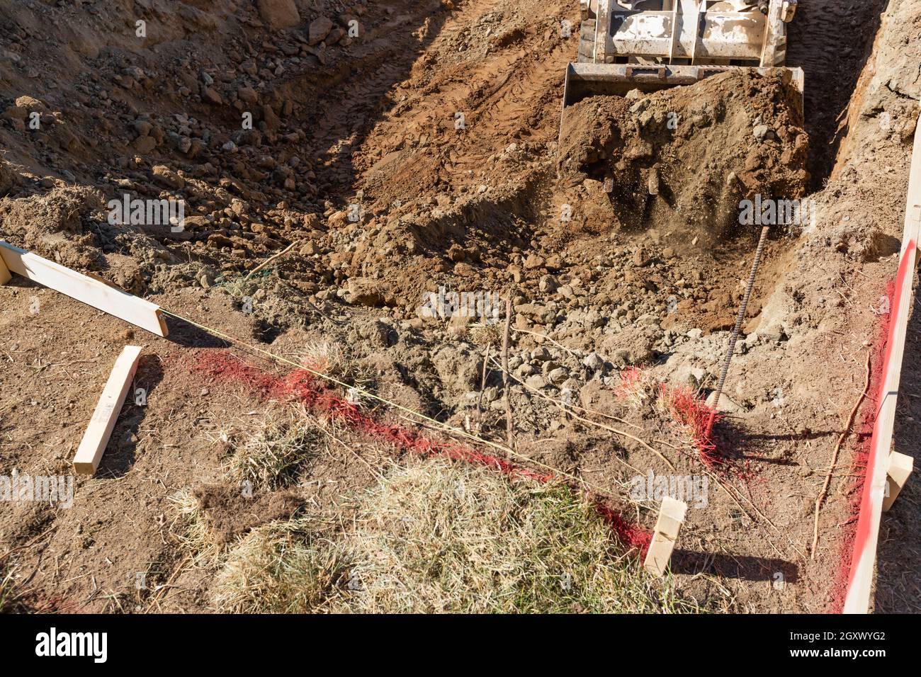 Small Bulldozer Digging In Yard For Pool Installation Stock Photo - Alamy