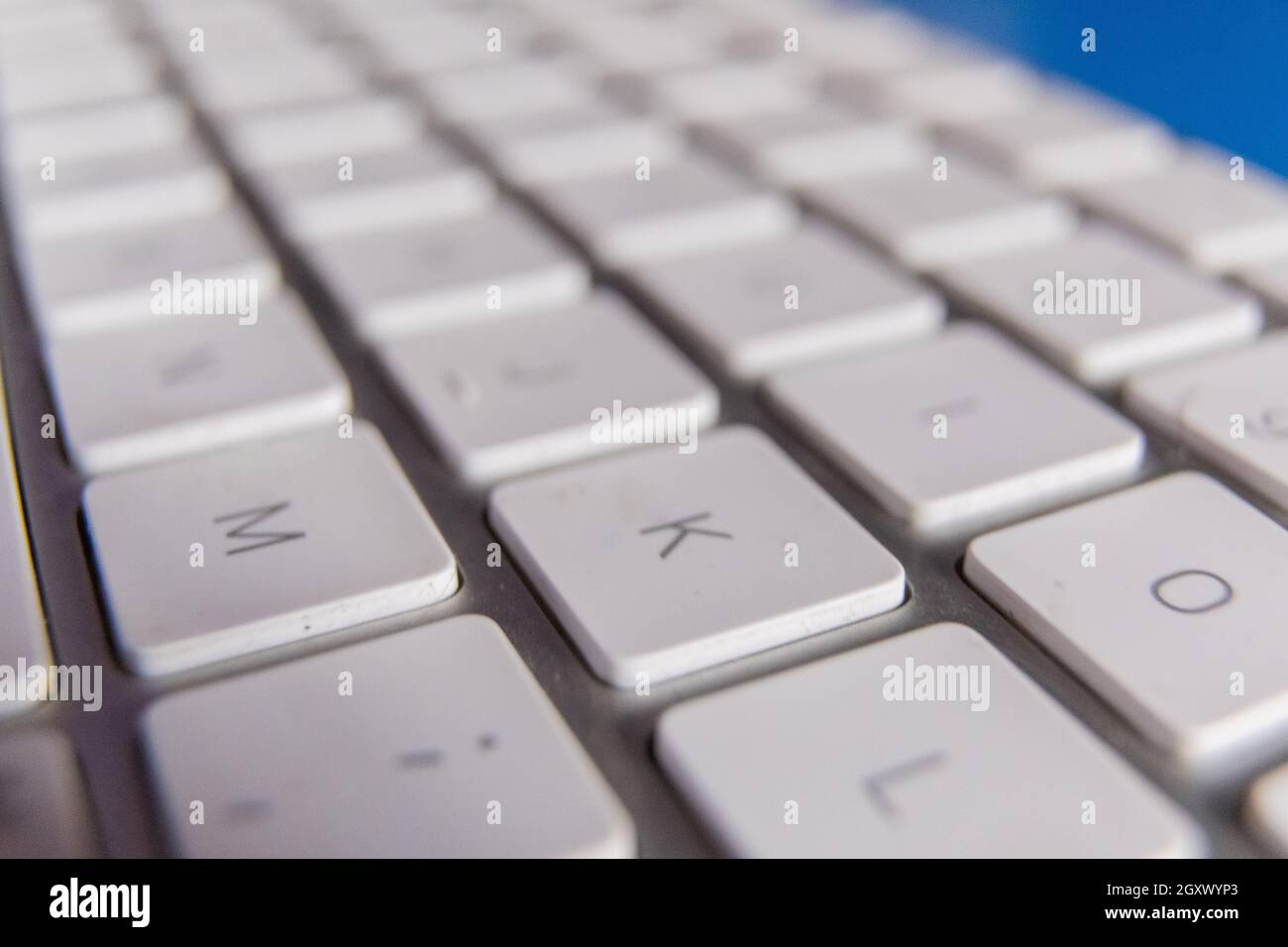 Close-up of modern white and silver keyboard Stock Photo - Alamy