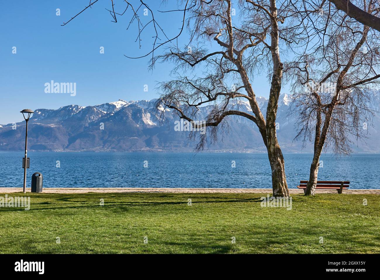 Park with view over Lake Geneva, sunny morning, inspiring scenery Stock ...