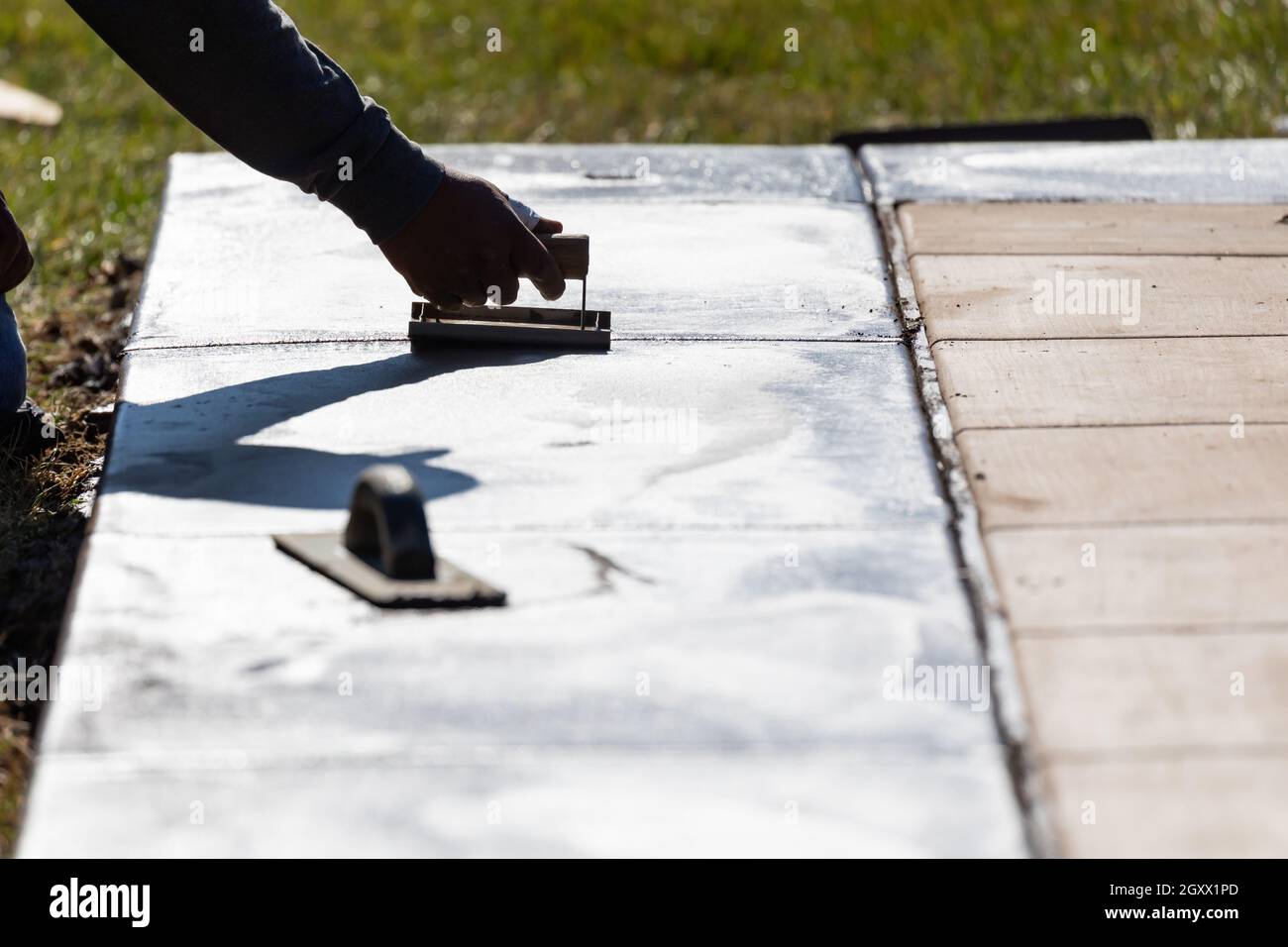 Construction Worker Smoothing Wet Cement With Hand Edger Tool Stock ...