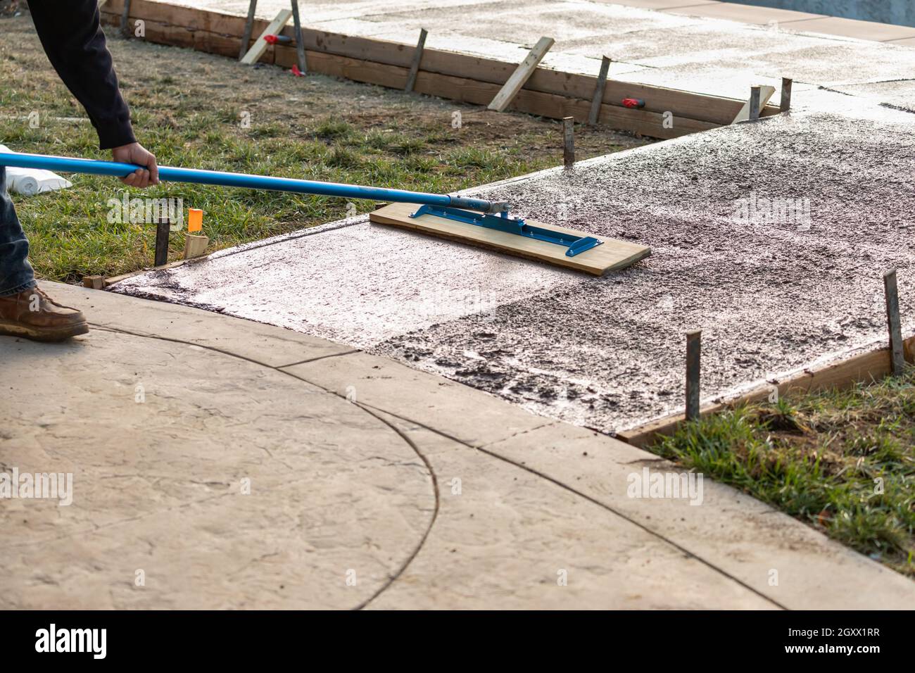 Construction Worker Smoothing Wet Cement With Trowel Tool Stock Photo ...
