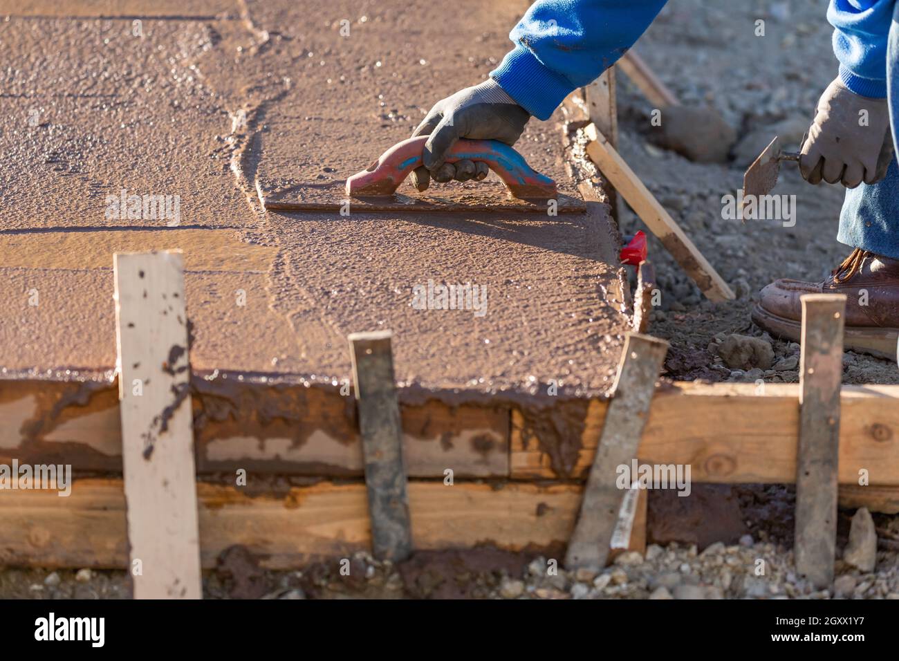Construction Worker Smoothing Wet Cement With Trowel Tools Stock Photo ...