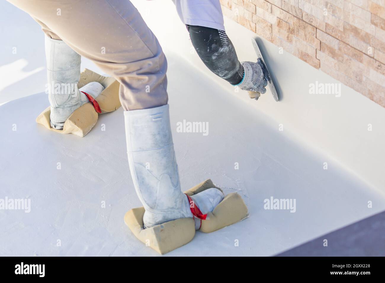 Worker applying plaster on hi-res stock photography and images - Alamy