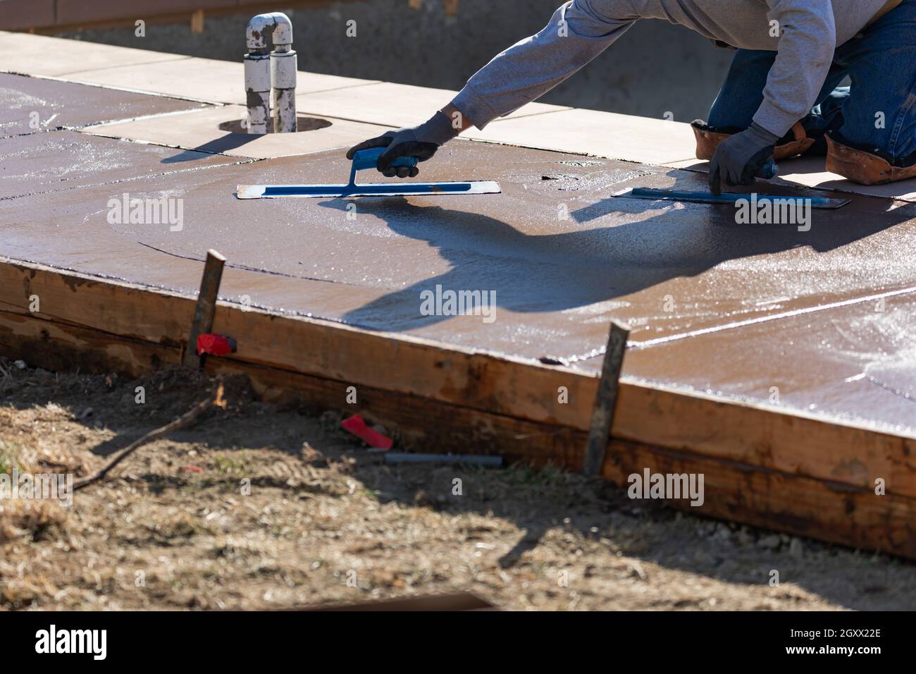 Construction Worker Smoothing Wet Cement With Trowel Tools Stock Photo ...