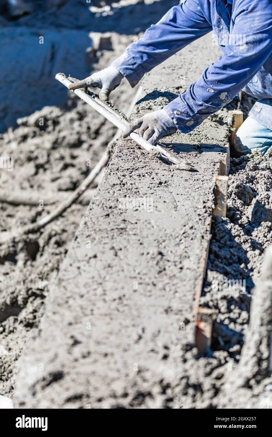 Pool Construction Worker Working With A Smoother Rod On Wet Concrete ...
