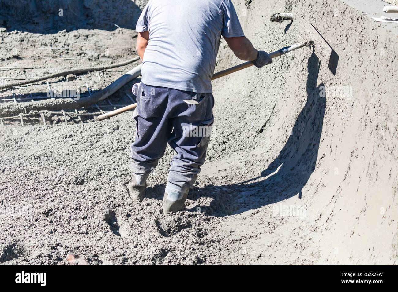 Pool Construction Worker Working With A Bullfloat On Wet Concrete Stock ...