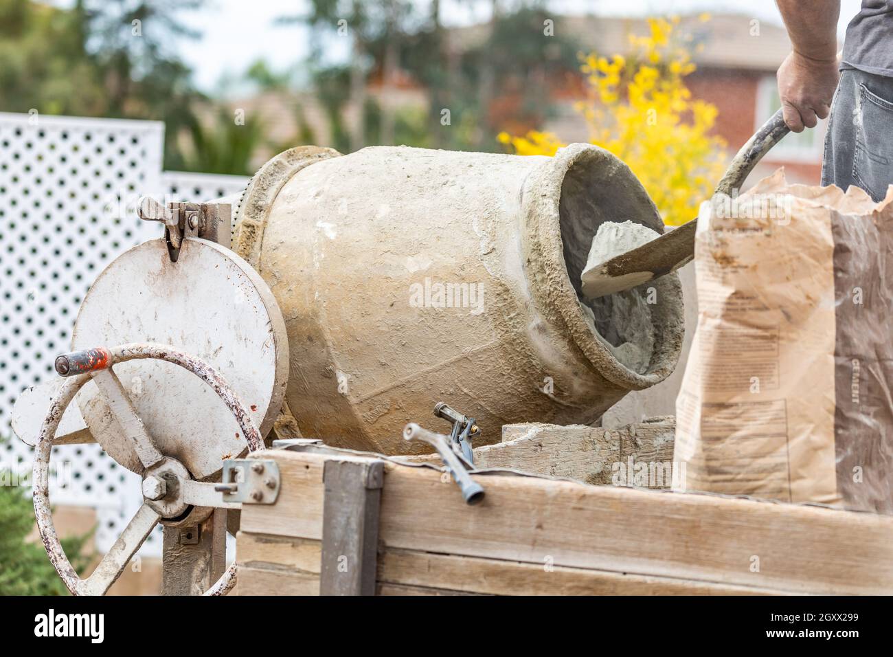 Construciton Worker Mixing Cement At Construction Site Stock Photo - Alamy