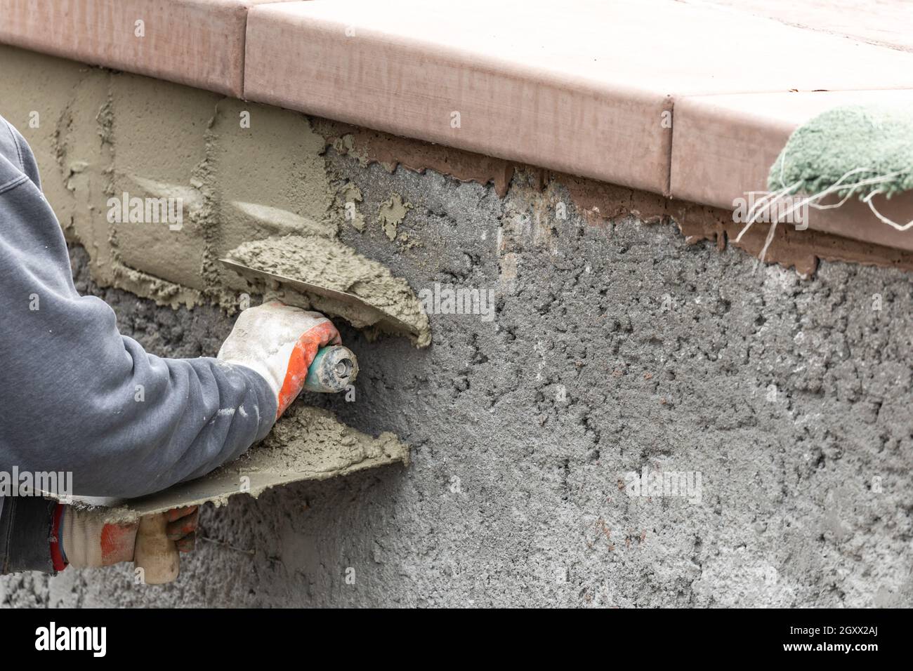Tile Worker Applying Cement with Trowel at Pool Construction Site Stock ...