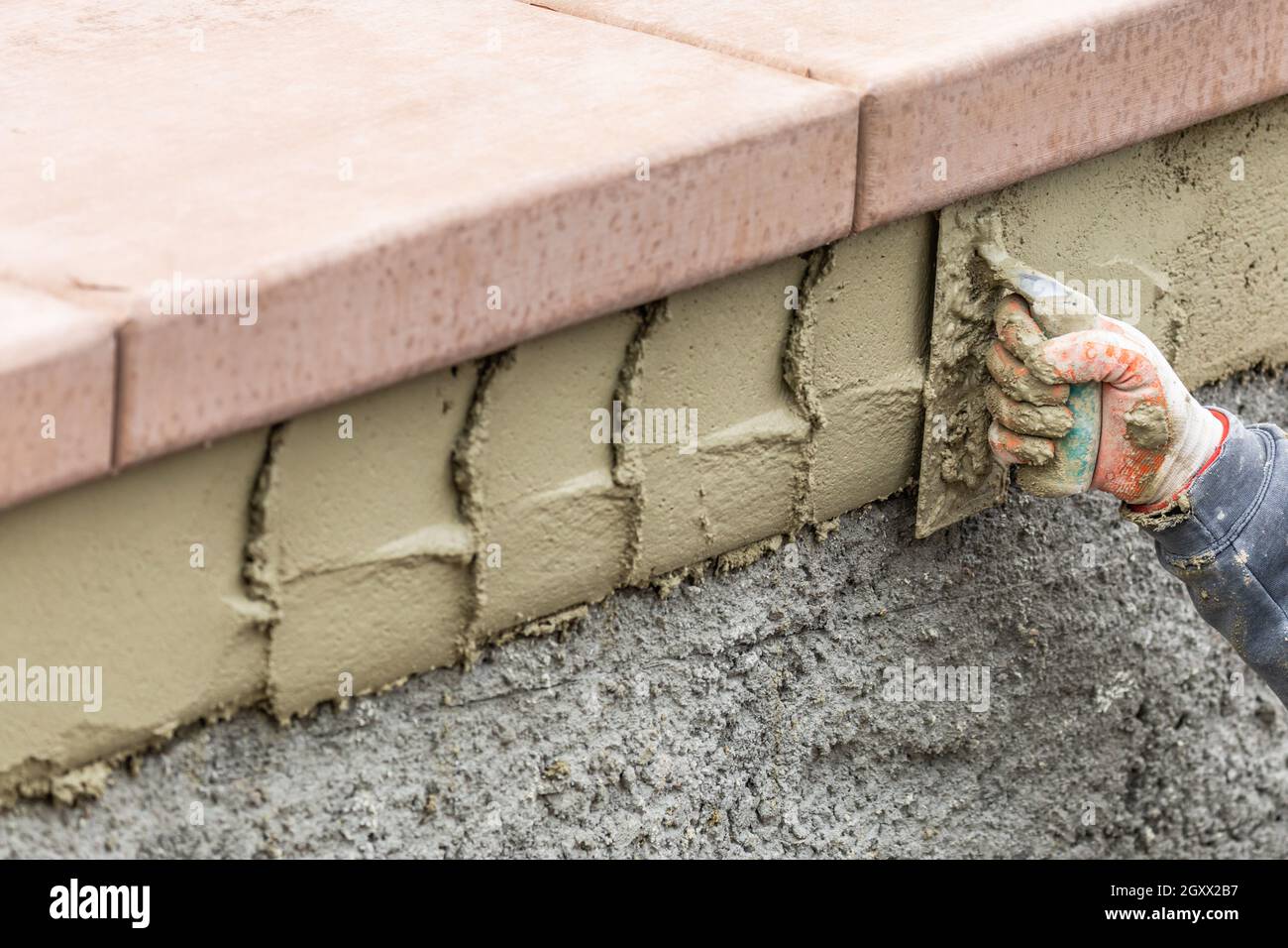 Tile Worker Applying Cement with Trowel at Pool Construction Site Stock ...