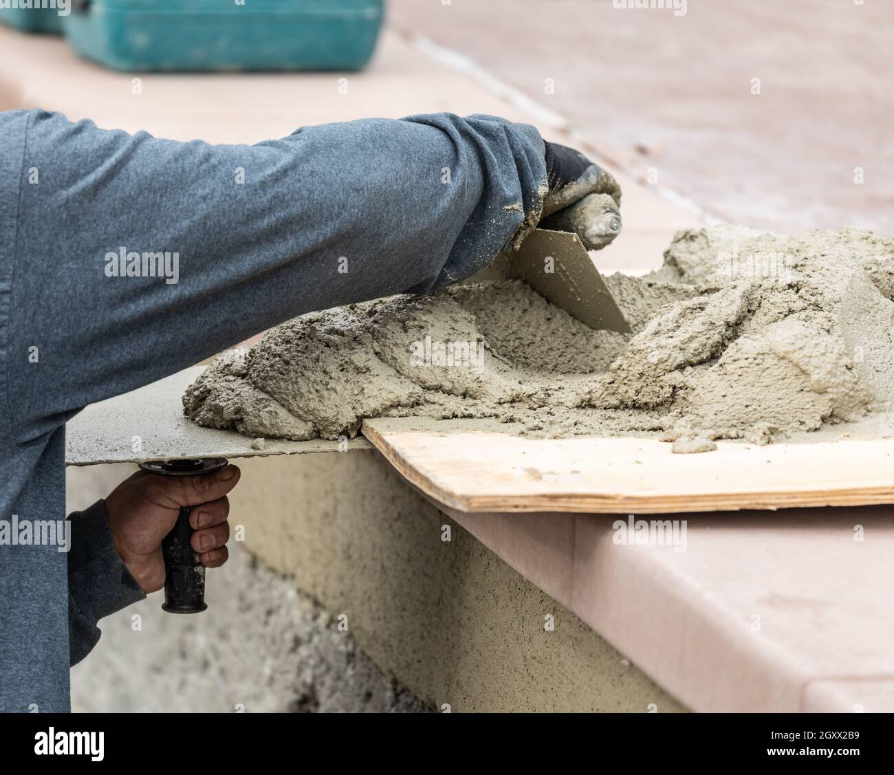 Tile Worker Mixing Wet Cement On Board At Pool Construction Site Stock ...