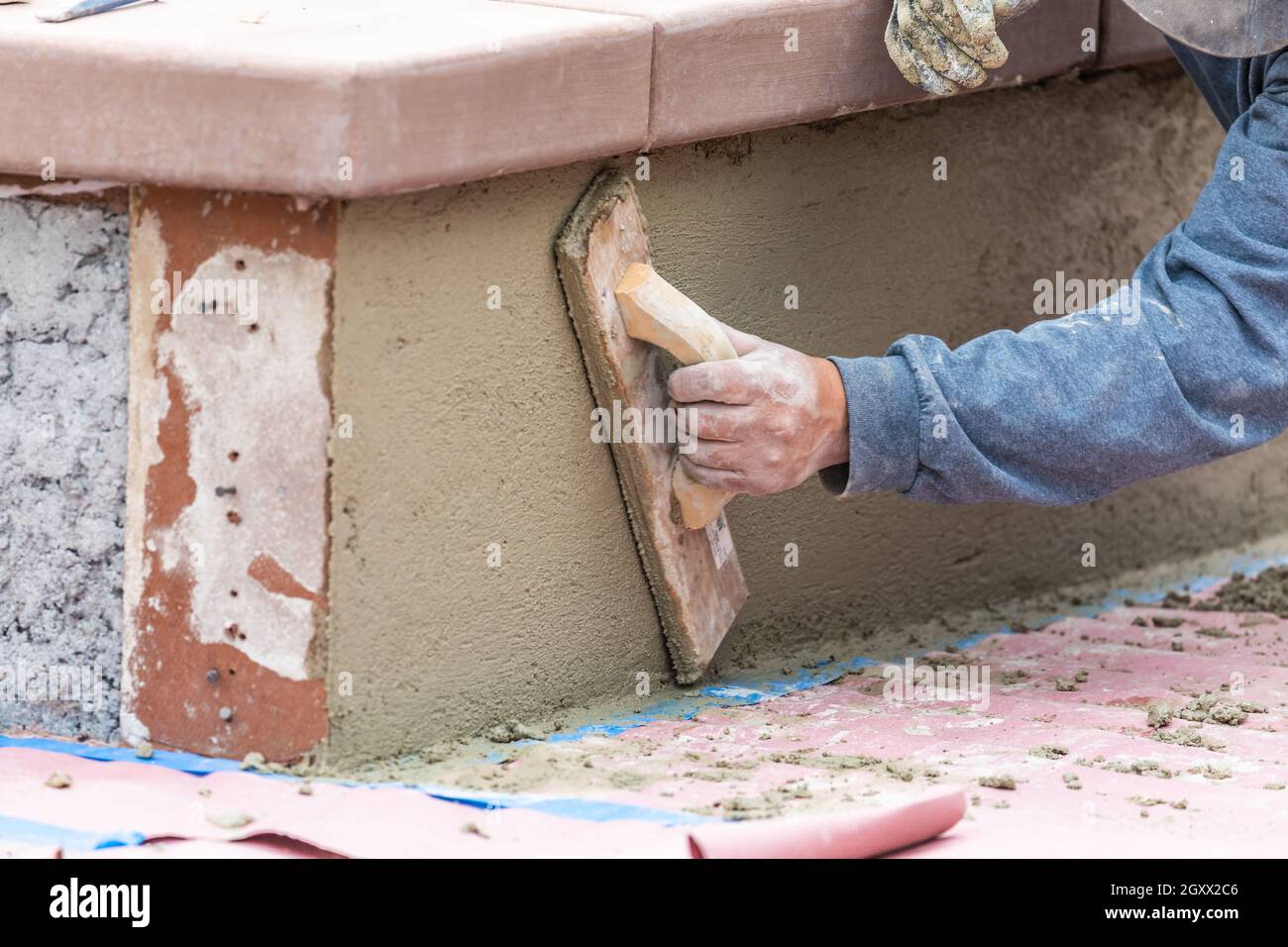 Worker Smoothing Cement with Wooden Float At Construction Site Stock ...