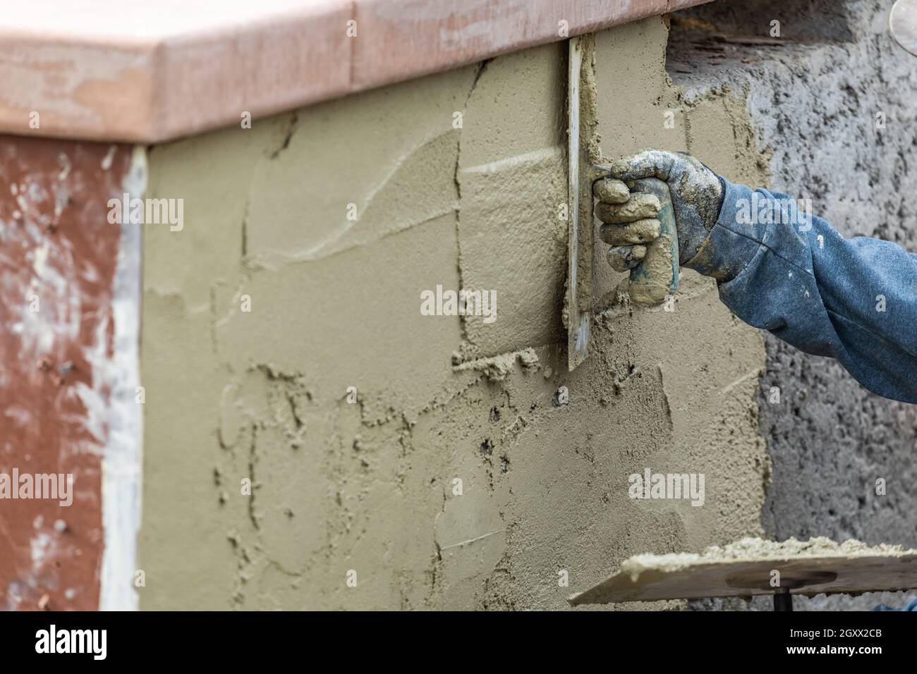 Tile Worker Applying Cement with Trowel at Pool Construction Site Stock ...