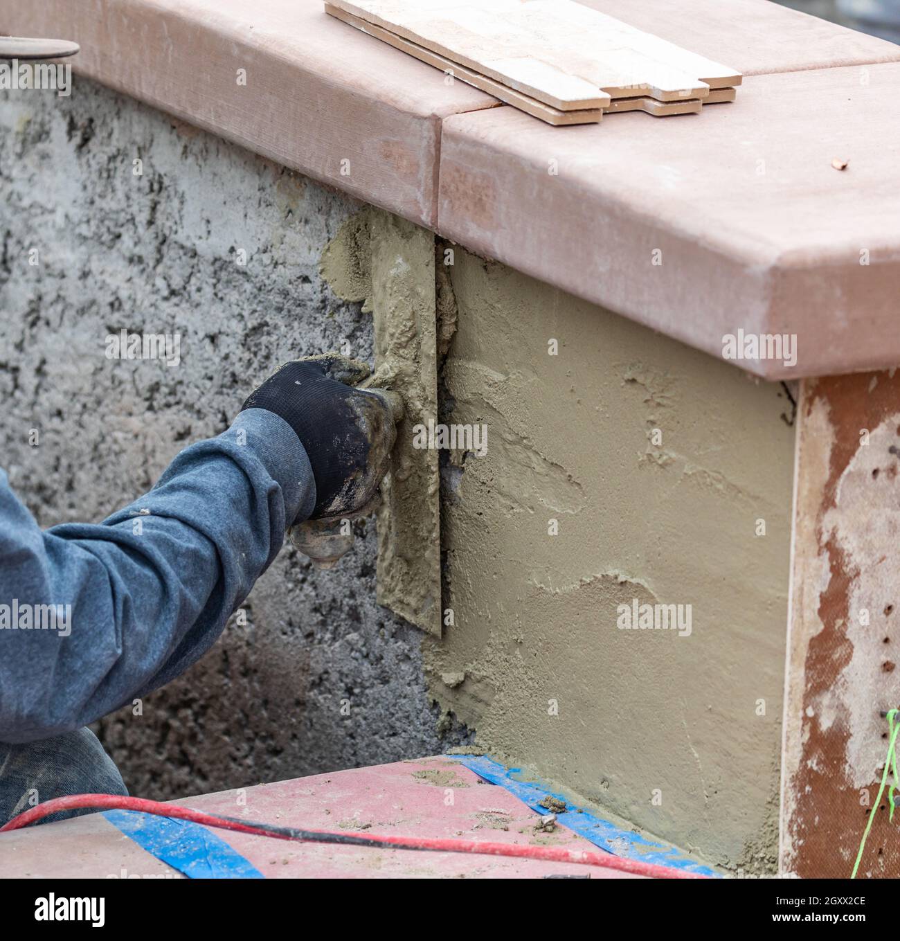 Tile Worker Applying Cement with Trowel at Pool Construction Site Stock ...