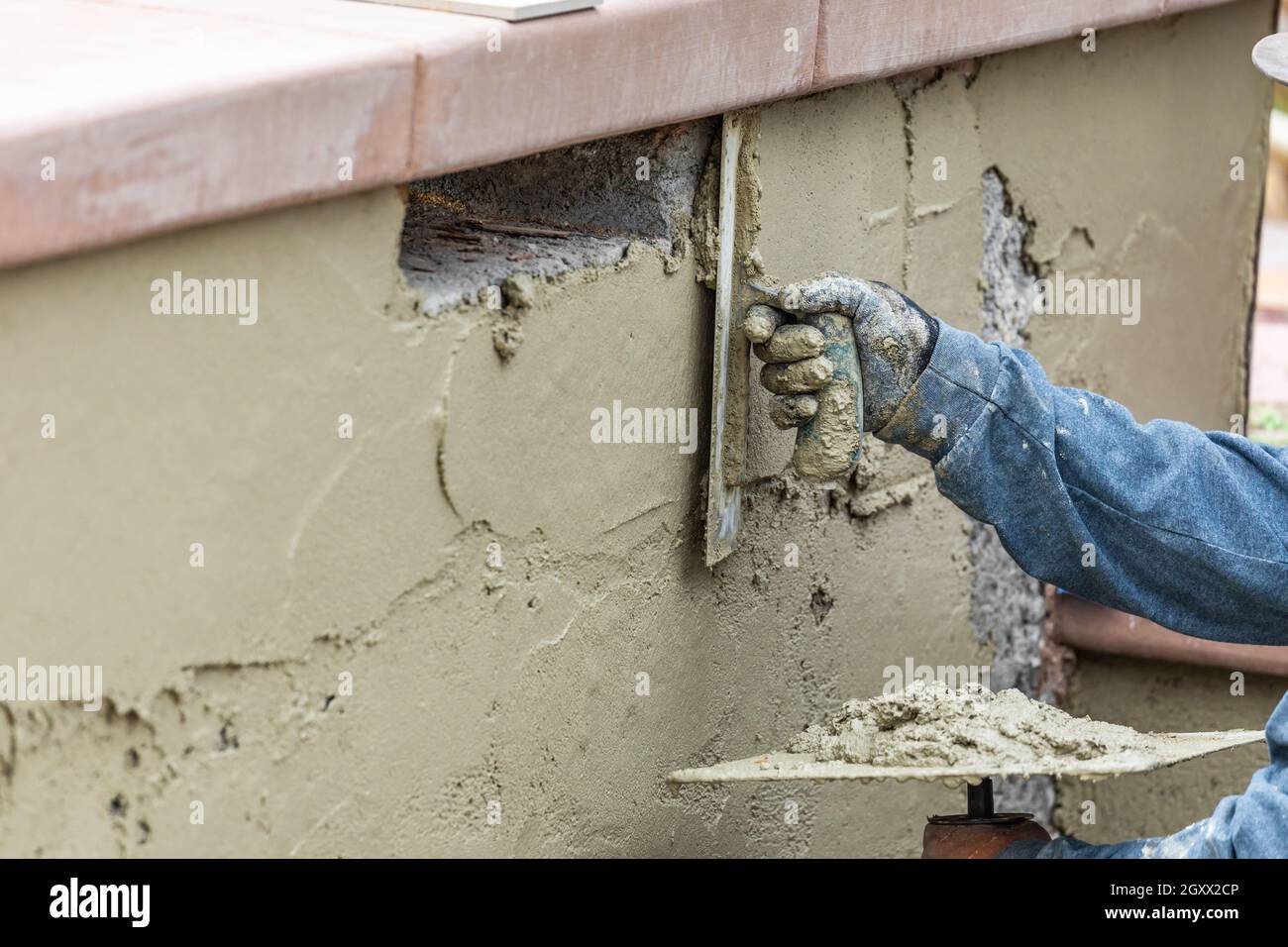 Tile Worker Applying Cement with Trowel at Pool Construction Site Stock ...