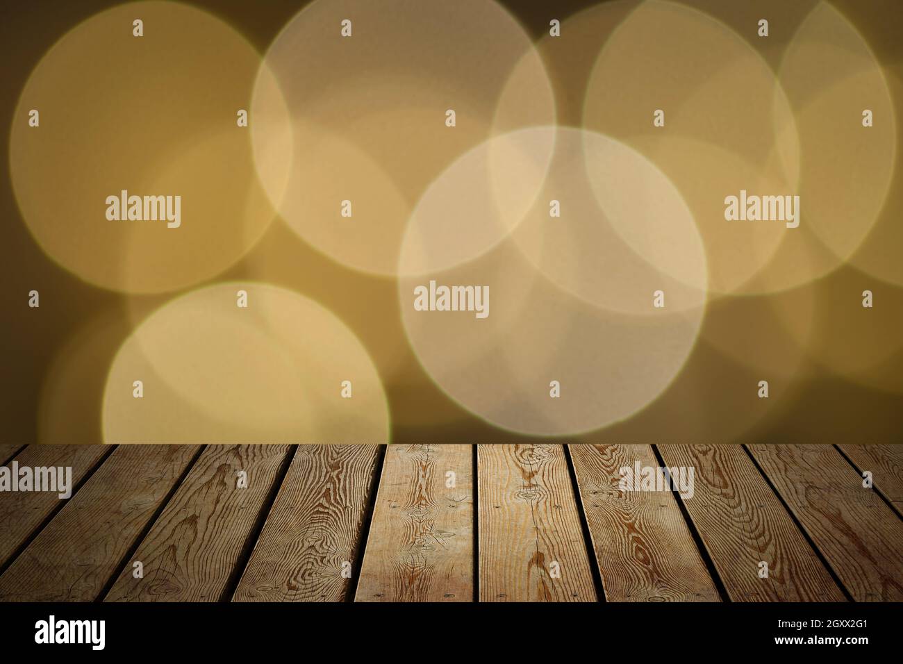 The background is an empty wooden board and a wall of blurred bokeh ...