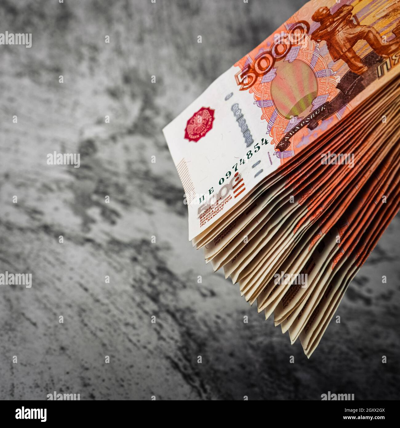 Russian rubles a large bundle on a gray background. A bundle of five ...