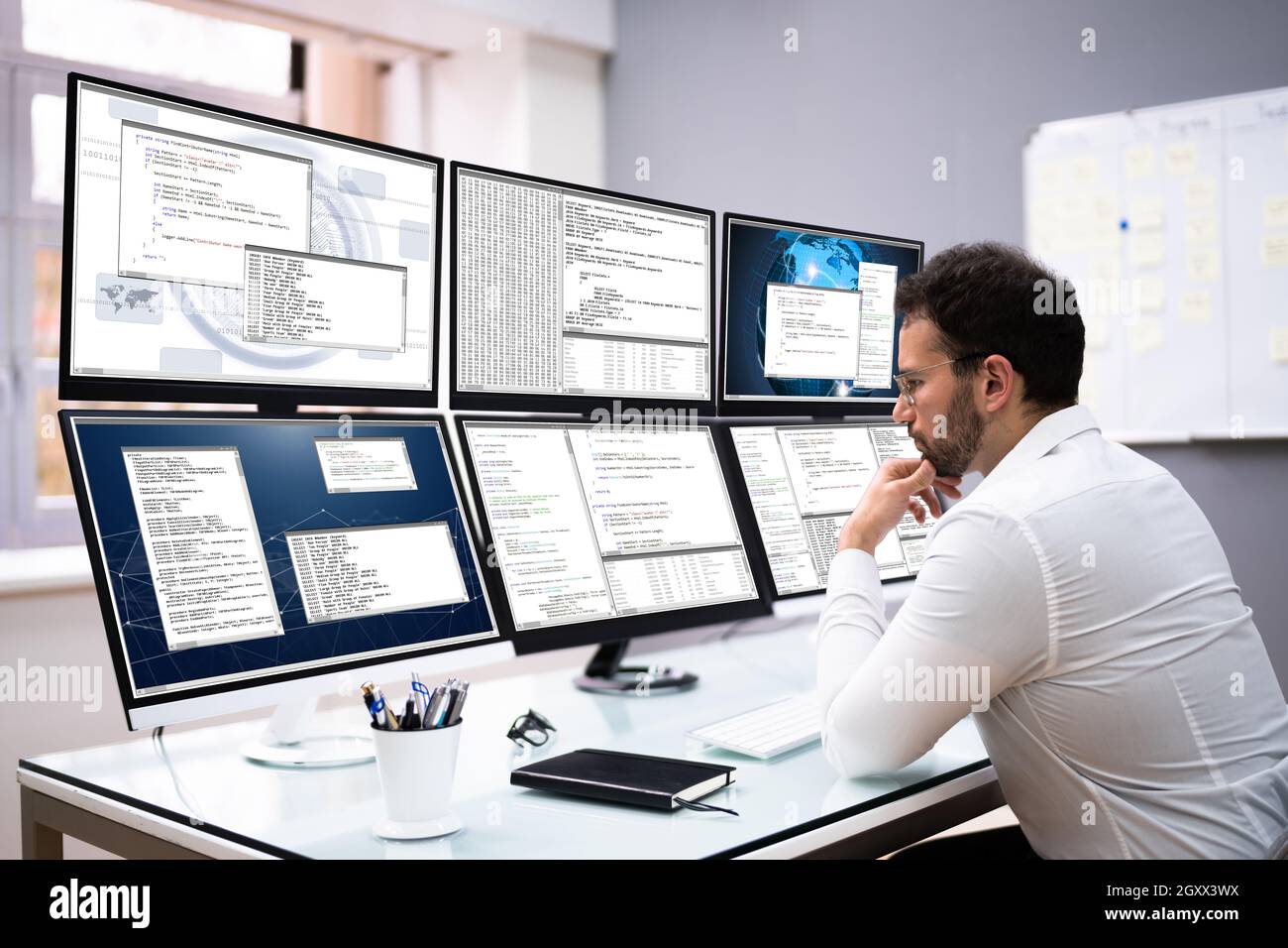 Software Developer Programming On Computer Monitor Screens Stock Photo ...