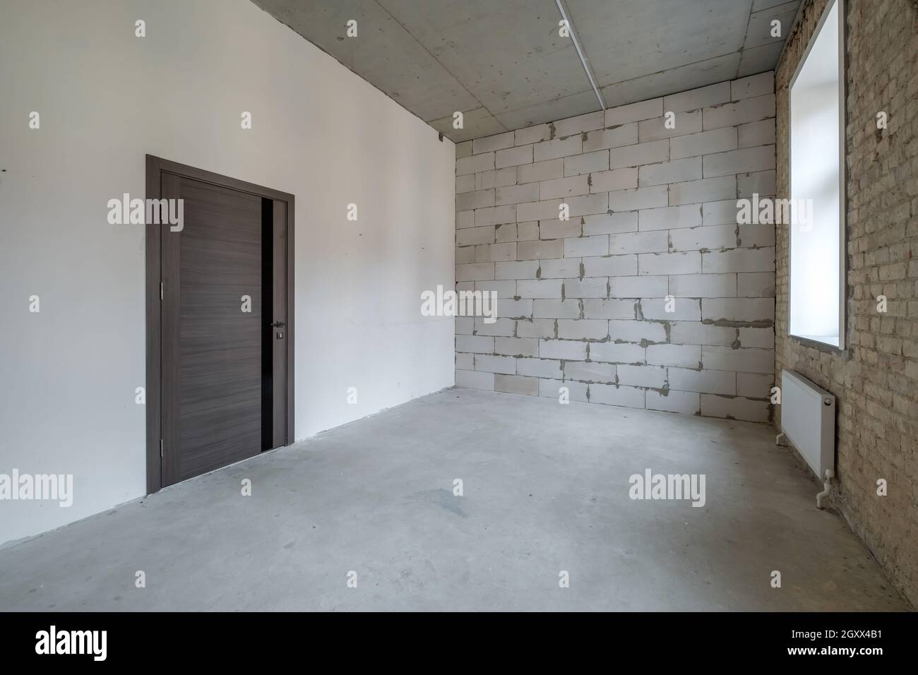 empty loft room with brick wall and repair and without furniture for ...