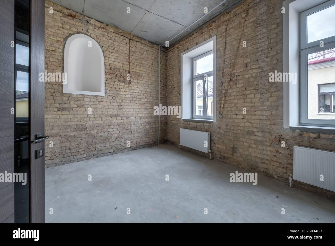 empty loft room with brick wall and repair and without furniture for ...