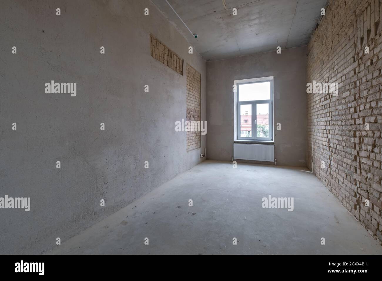 empty loft room with brick wall and repair and without furniture for ...