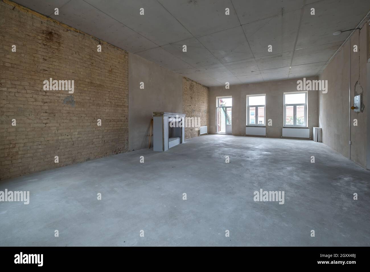 empty loft room with brick wall and repair and without furniture for ...