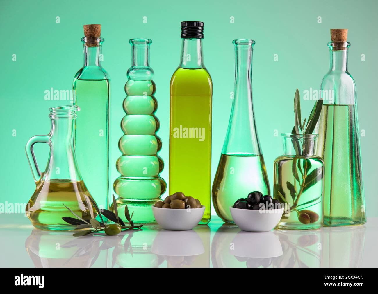 Bottles of olive oil, olive branch and Cooking oils Stock Photo - Alamy
