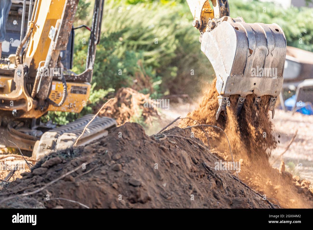 Working Excavator Tractor Digging A Trench At Construction Site Stock ...