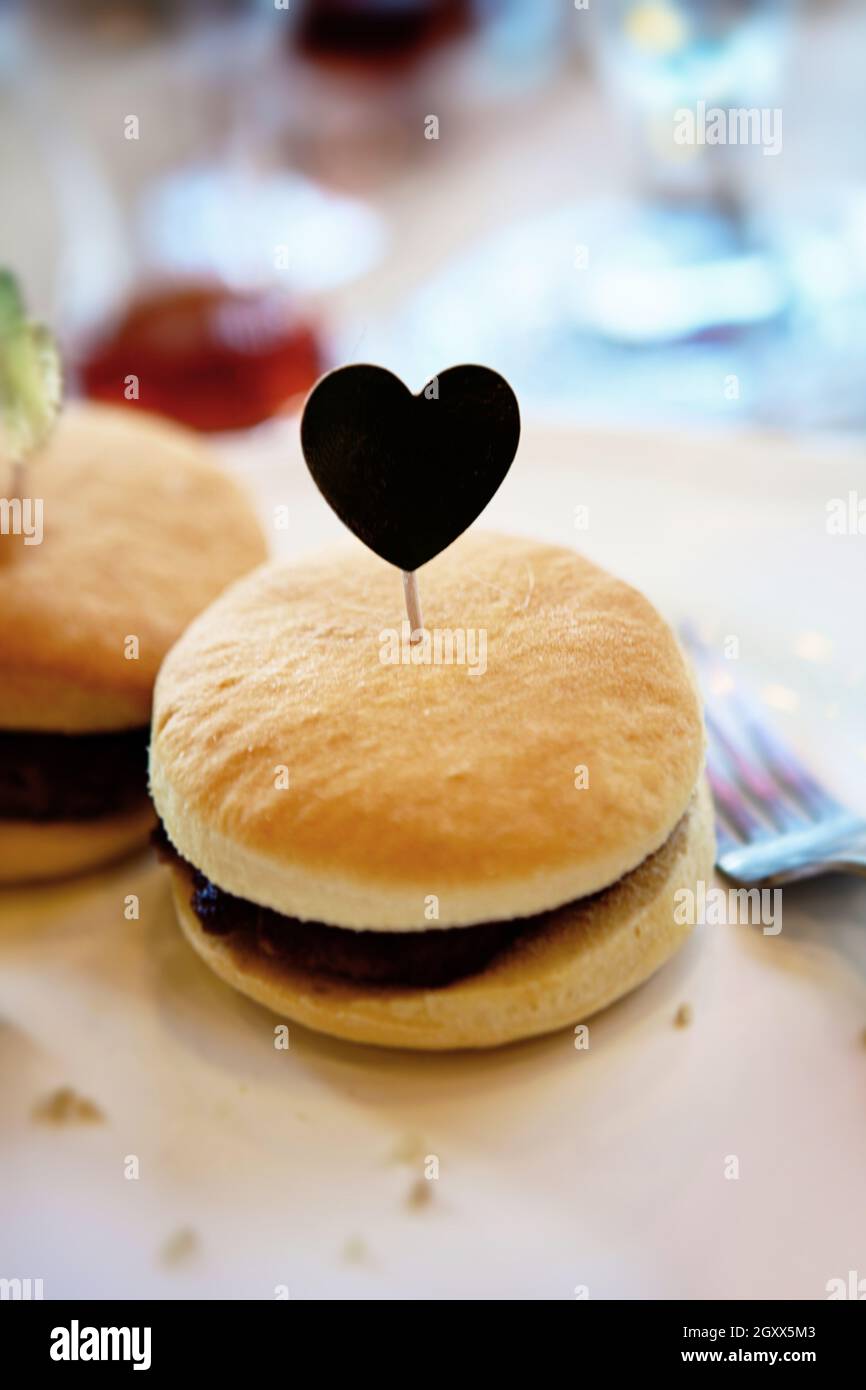 Mini hamburger with a heart burger stick decoration Stock Photo - Alamy