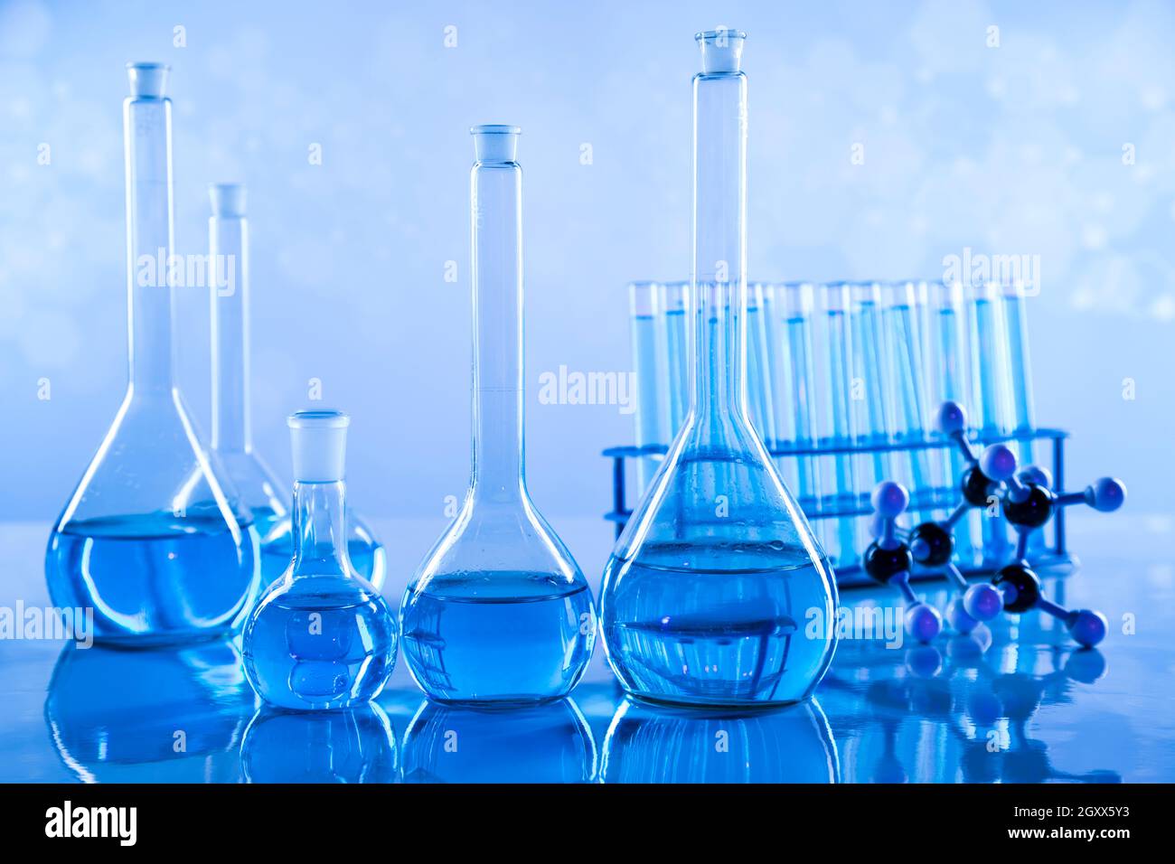 Laboratory beakers,Science experiment, blue background Stock Photo - Alamy