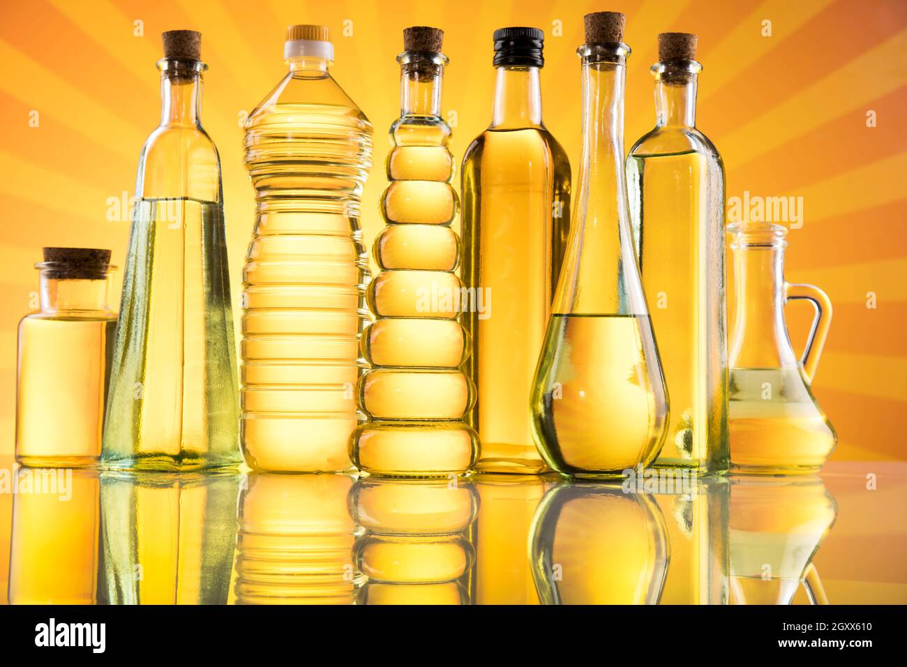 Olive oil bottles, olive branch and Cooking oils Stock Photo - Alamy