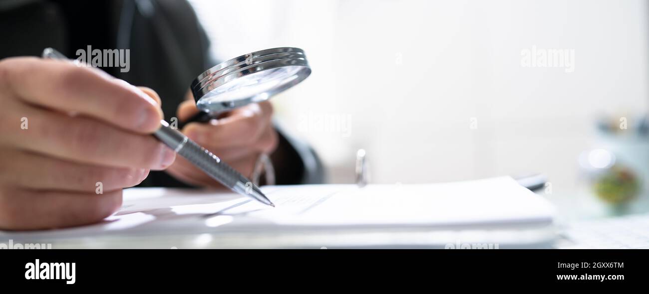 Audit And Fraud Investigation. Auditor Using Magnifying Glass On ...