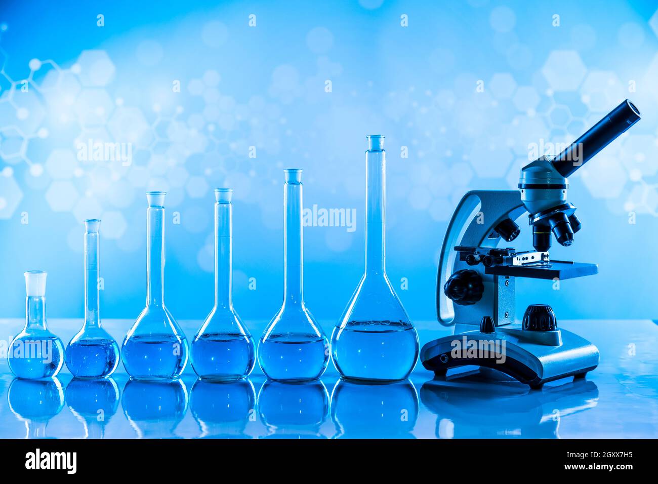 Laboratory beakers,Science experiment, blue background Stock Photo - Alamy